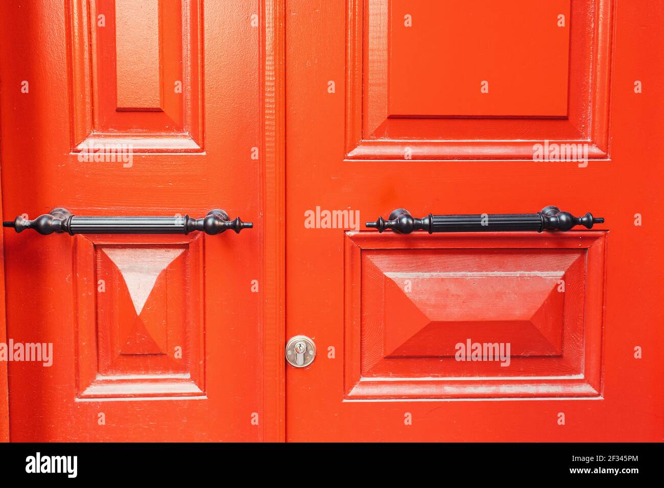 wooden doors, painted in bright red color, with metallic handles Stock ...