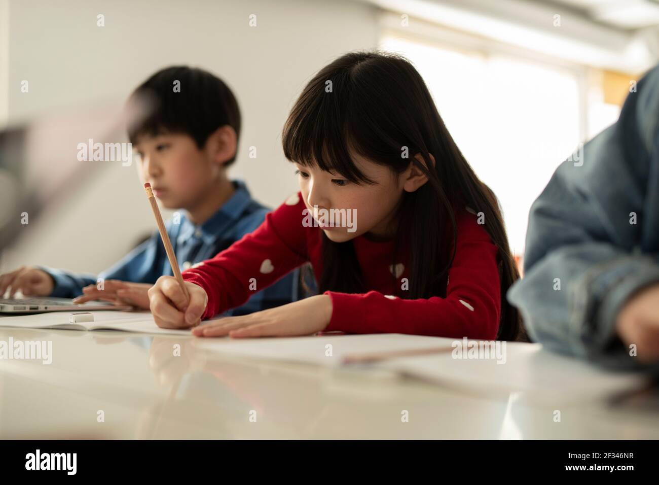 ICT in Education - Girl Transcribing Stock Photo - Alamy