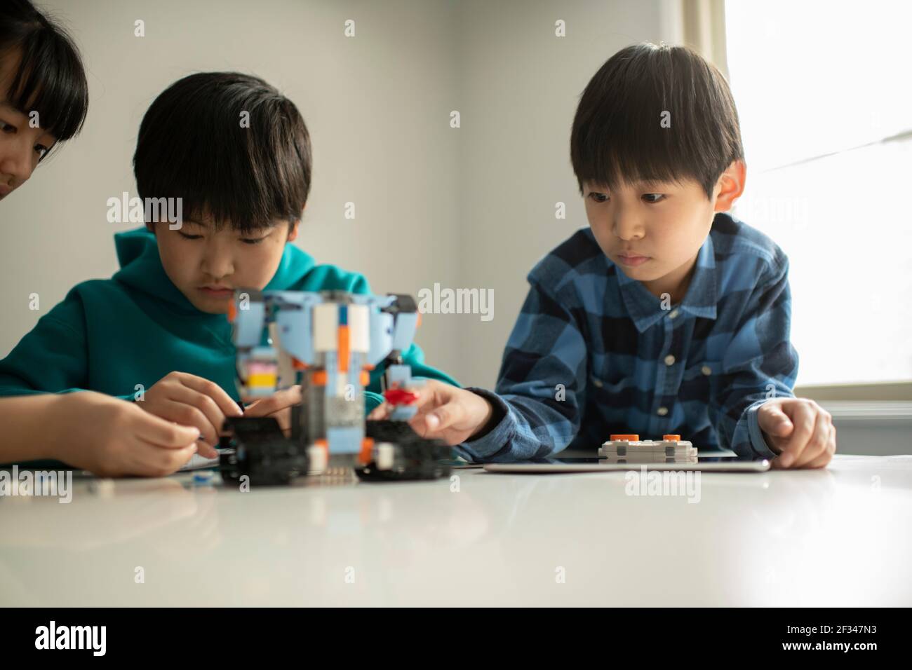 Elementary School Students Assembling Programming Robot Stock Photo - Alamy