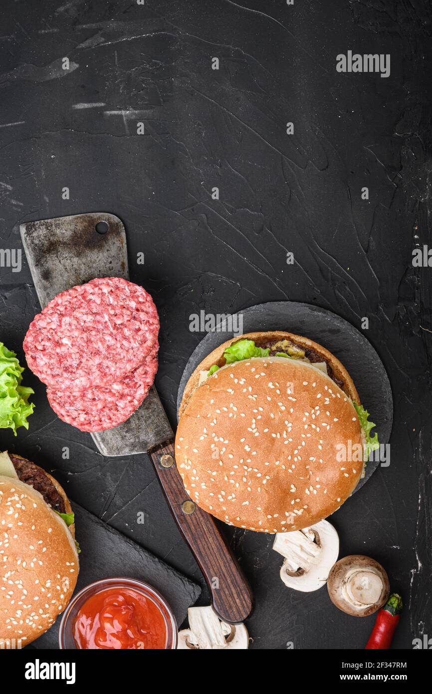 American burger components on black background, flat lay with copy ...