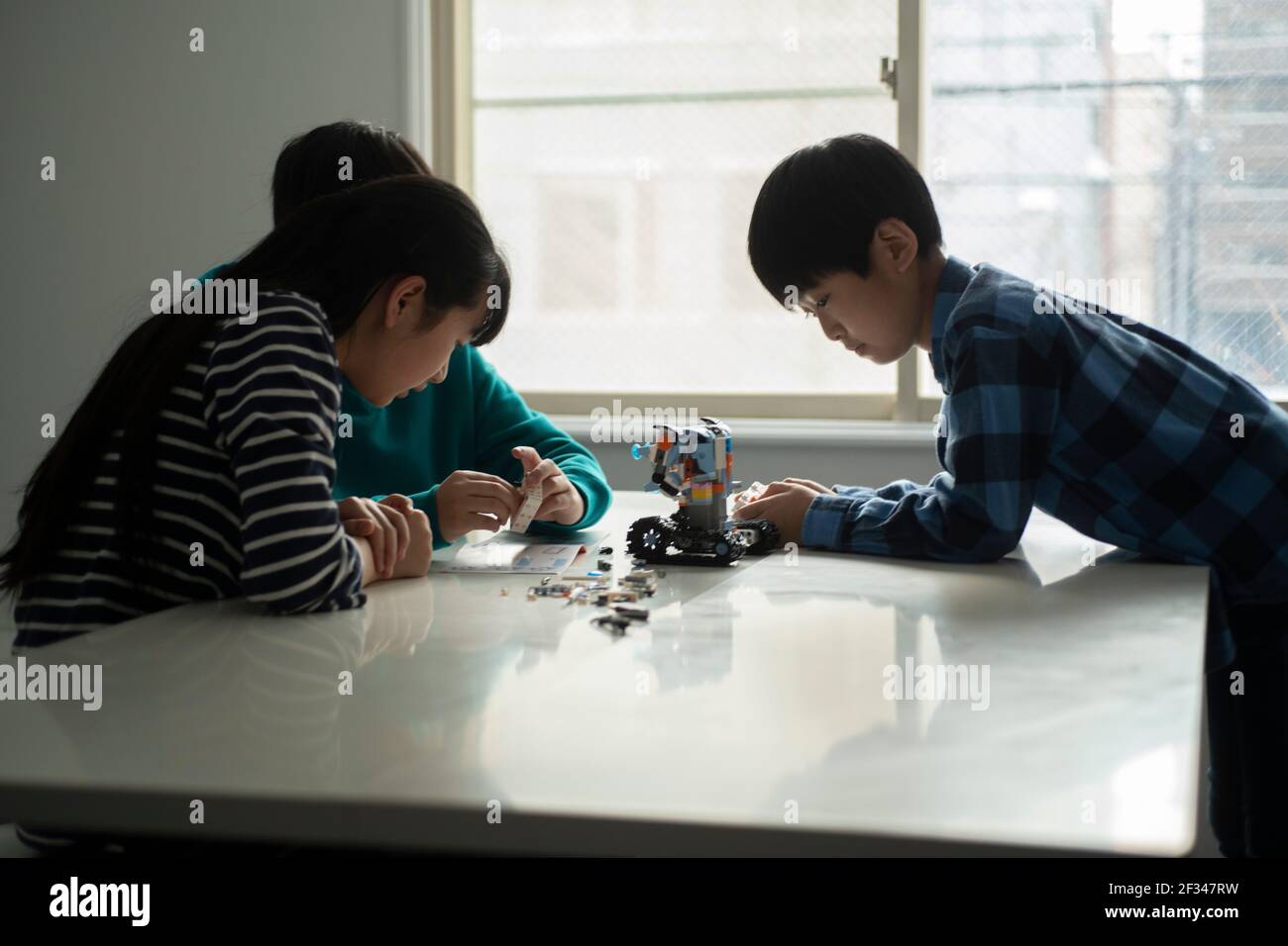 Programming robot hi-res stock photography and images - Alamy