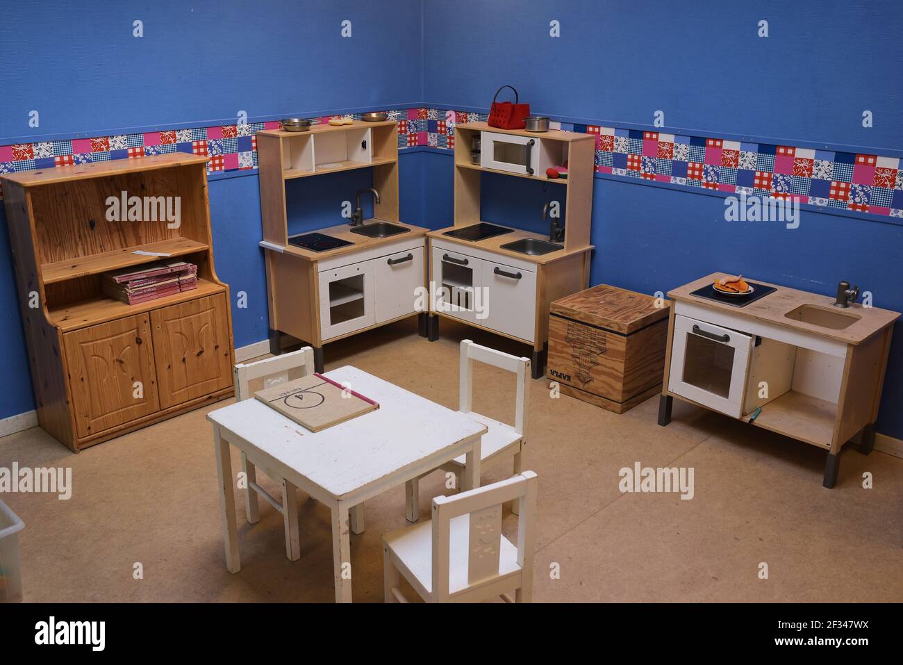 Corner in classroom with toys and play kitchens for kids to play Stock ...