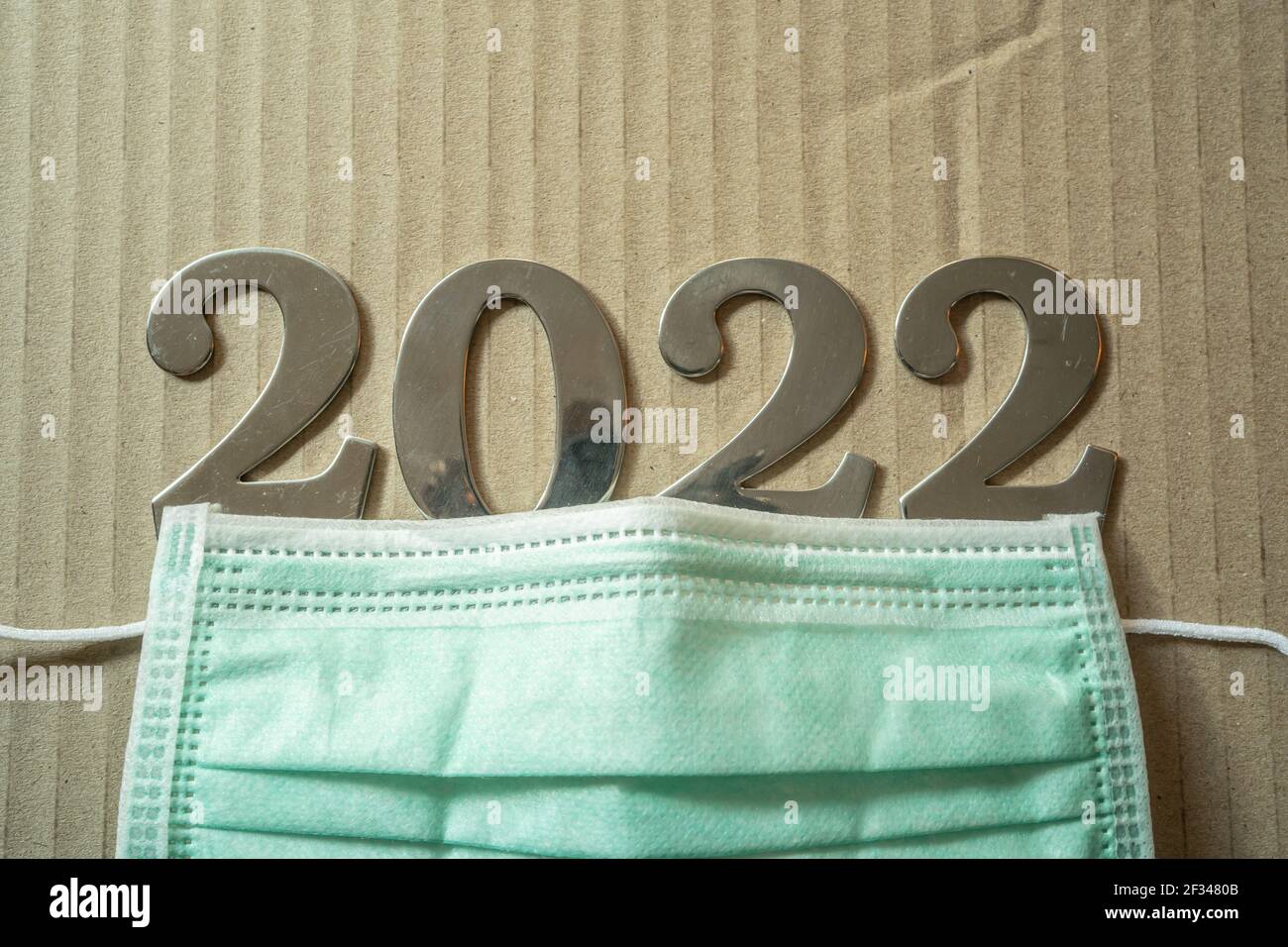 2022 under a face mask Stock Photo - Alamy