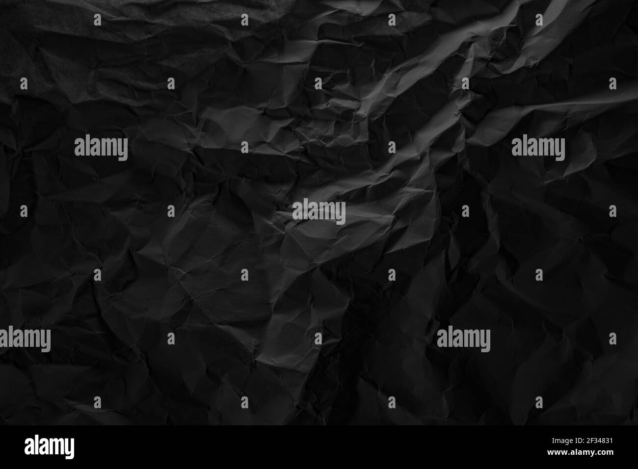Black crumpled paper texture in low light background Stock Photo - Alamy