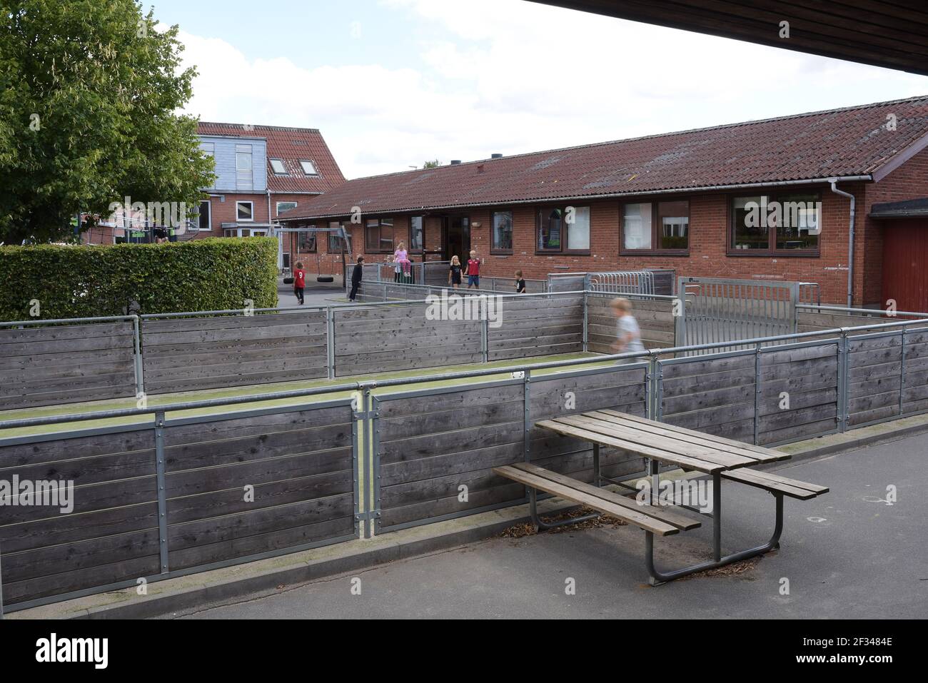 Empty schoolyard benches for kids recess Stock Photo - Alamy