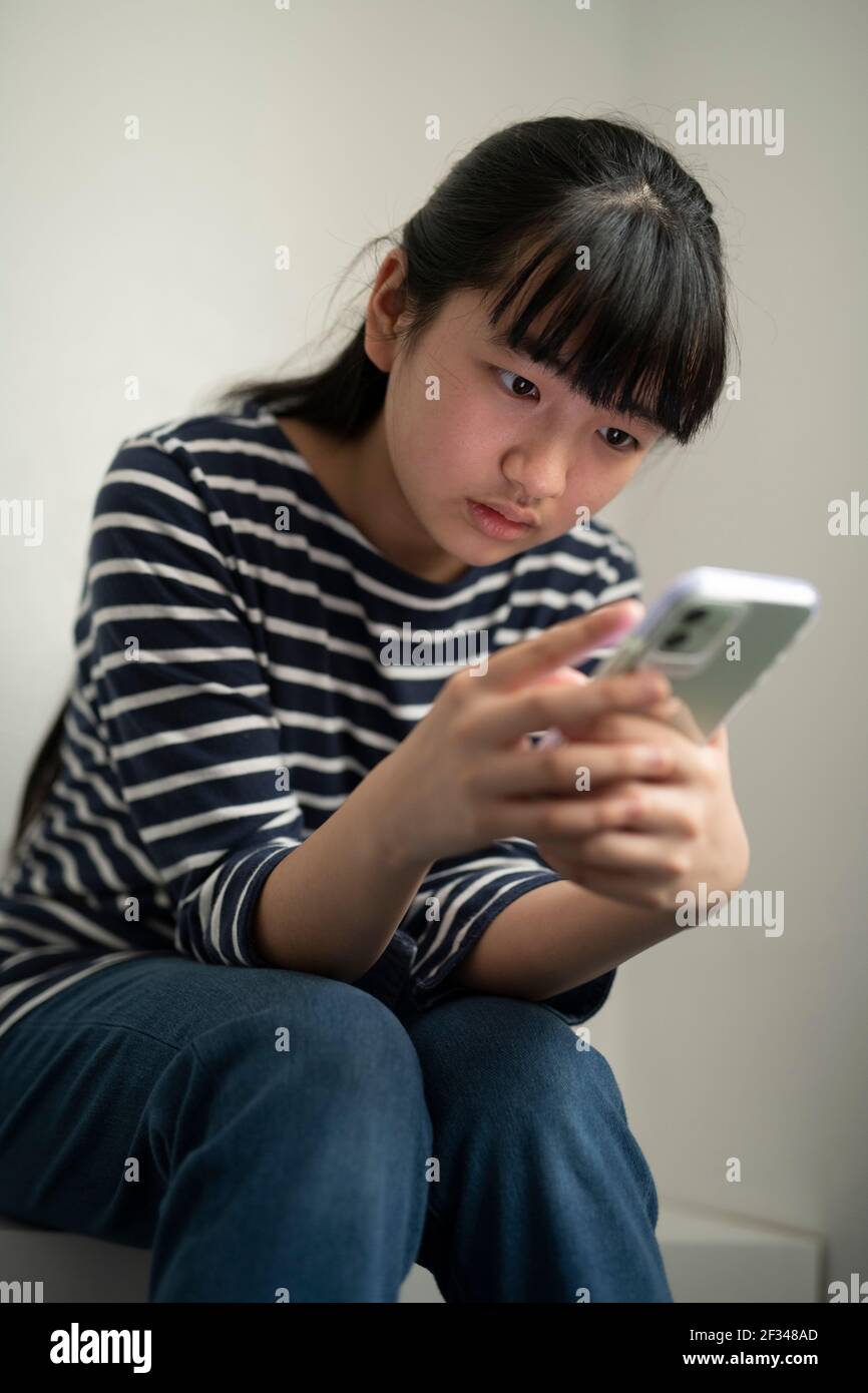 Girl Obsessed with Smartphone Stock Photo - Alamy