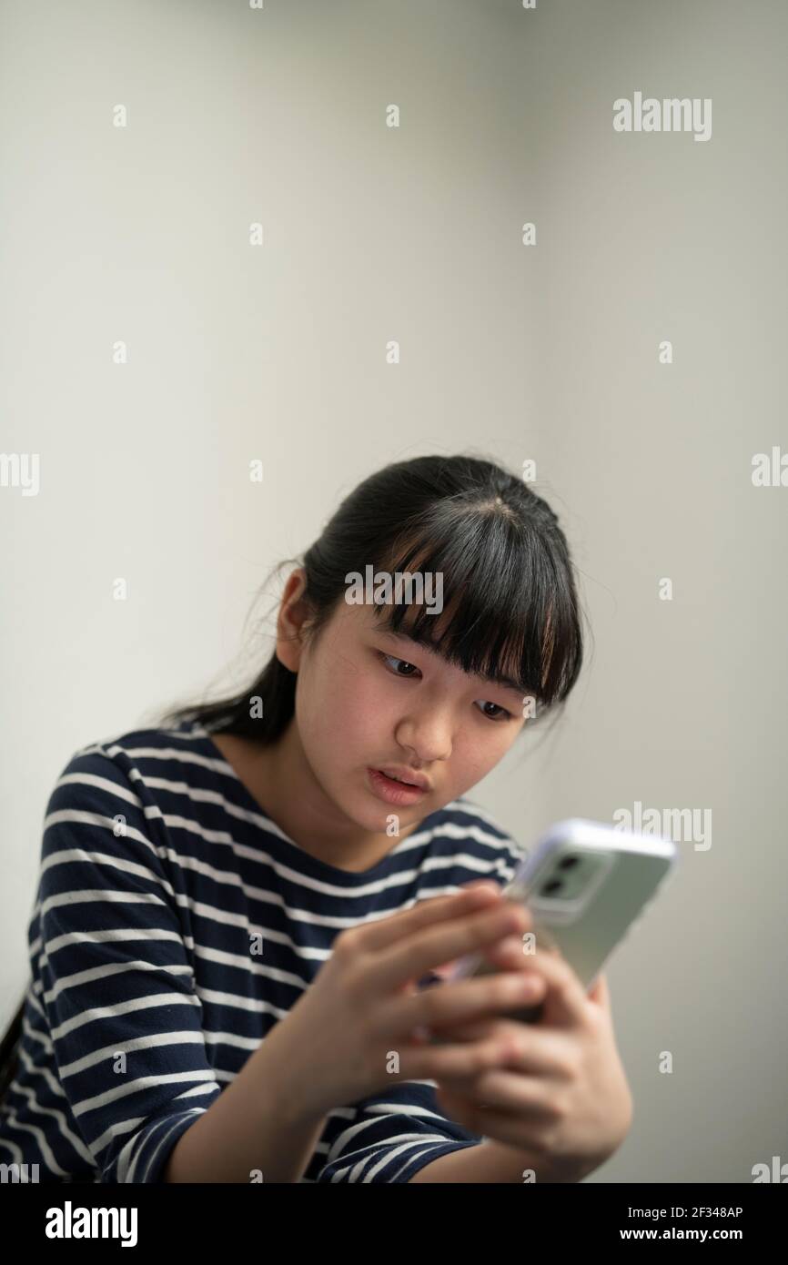 Child cell phone obsessed hi-res stock photography and images - Alamy