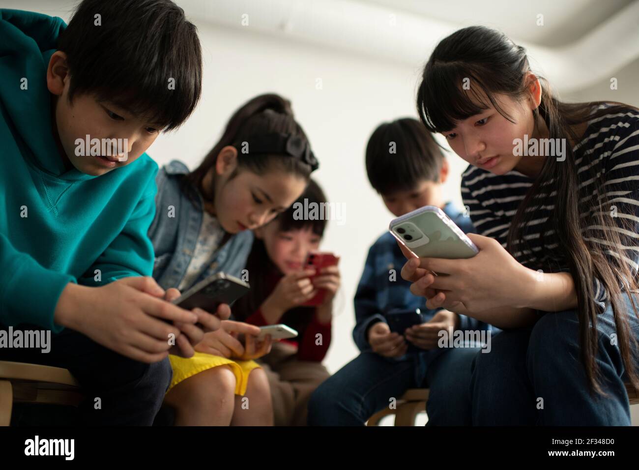 Social media smartphone obsessed hi-res stock photography and images ...