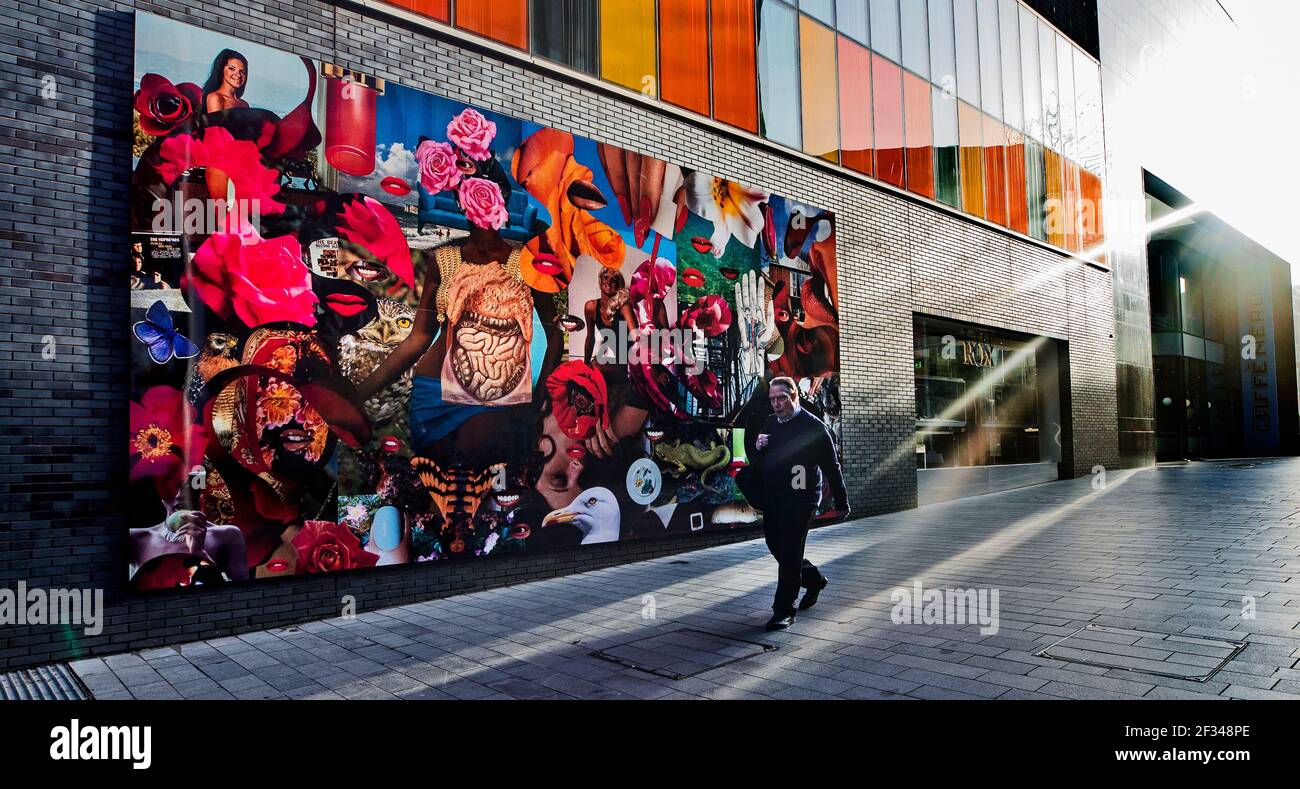 A pedestrian passes a major new billboard by Linder, located within the ...