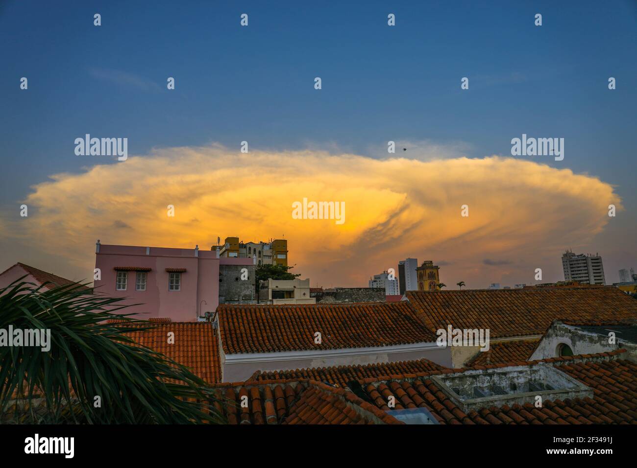 A beautiful view of the sunset sky over a neighborhood with old ...