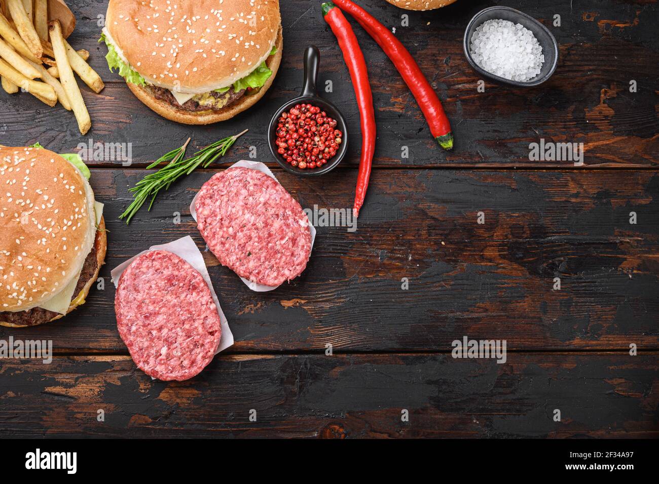 Raw burger cooking a burger with meat on dark wooden background with ...