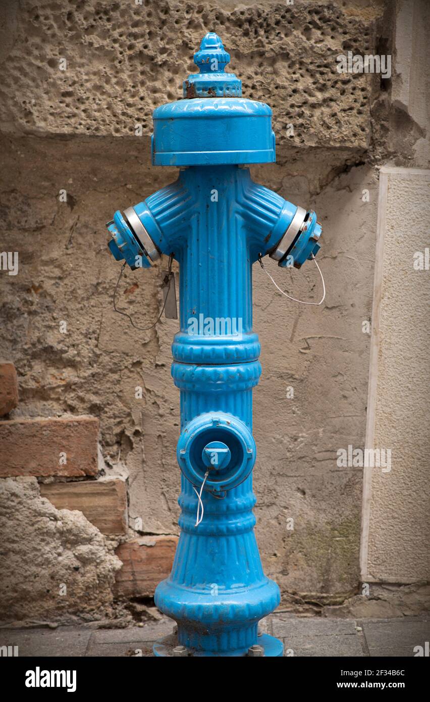 Close-up view with blue fire hydrant on the street Stock Photo - Alamy