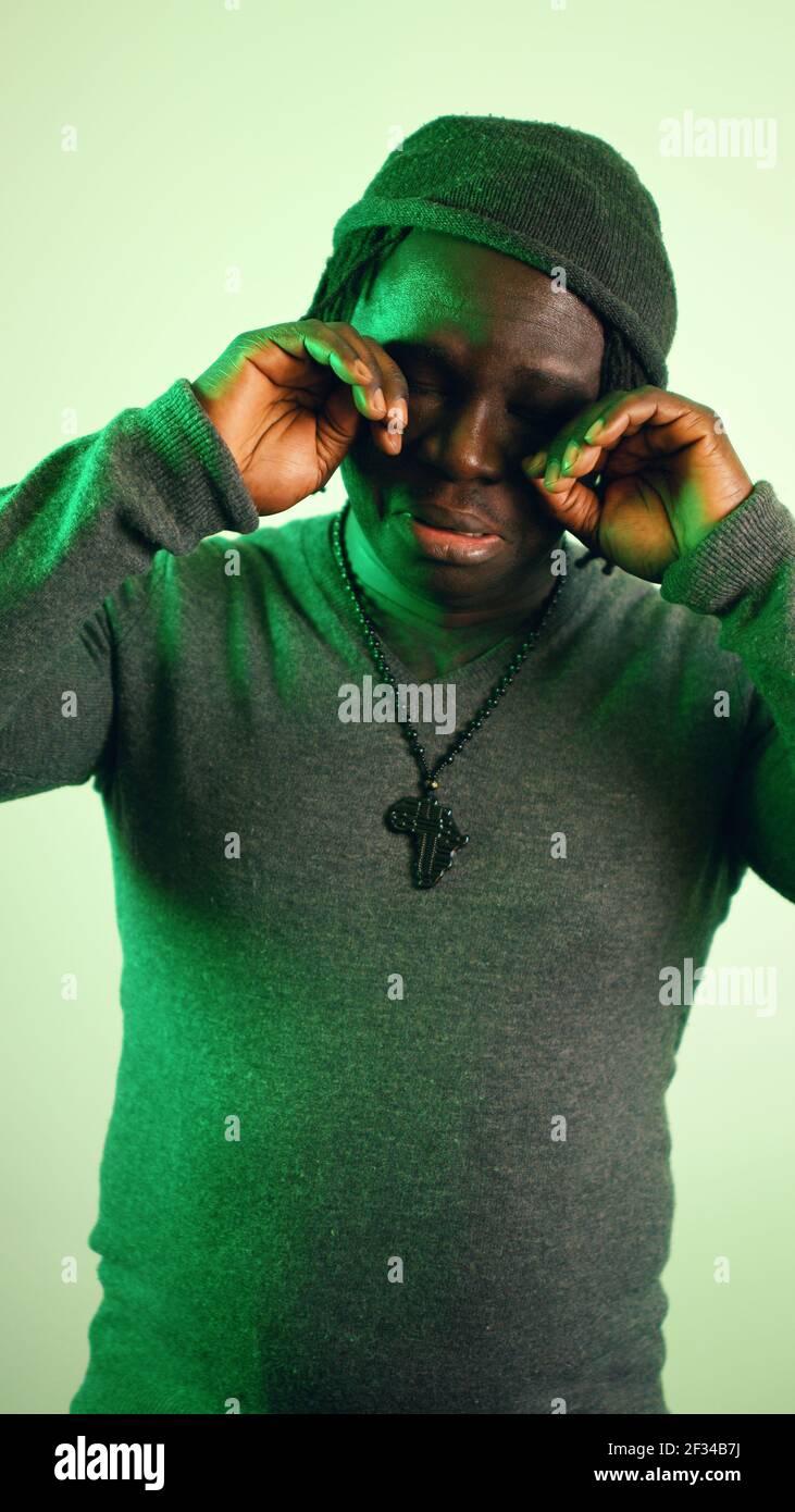 Sarcastic crying, african american black man pretending to wipe his ...