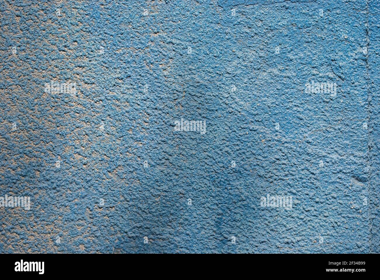 Blue plastered house facade wall detail closeup as grunge background ...