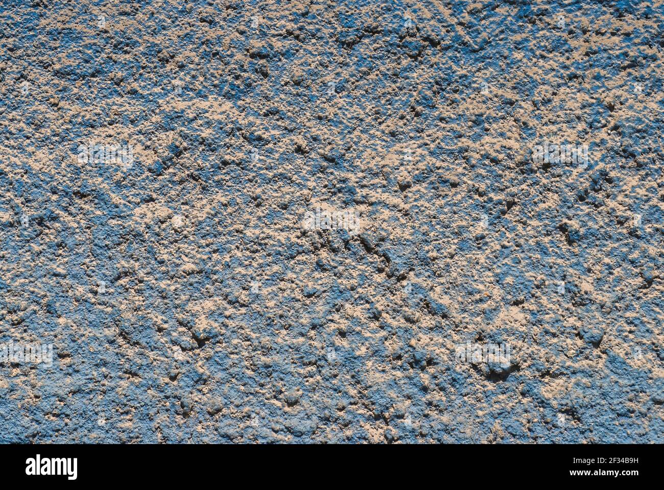 Blue plastered house facade wall detail closeup as grunge background ...