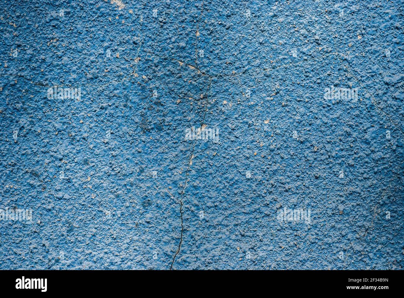 Blue plastered house facade wall detail closeup as grunge background ...