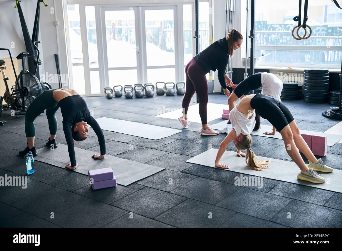 Gym positions woman hi-res stock photography and images - Alamy