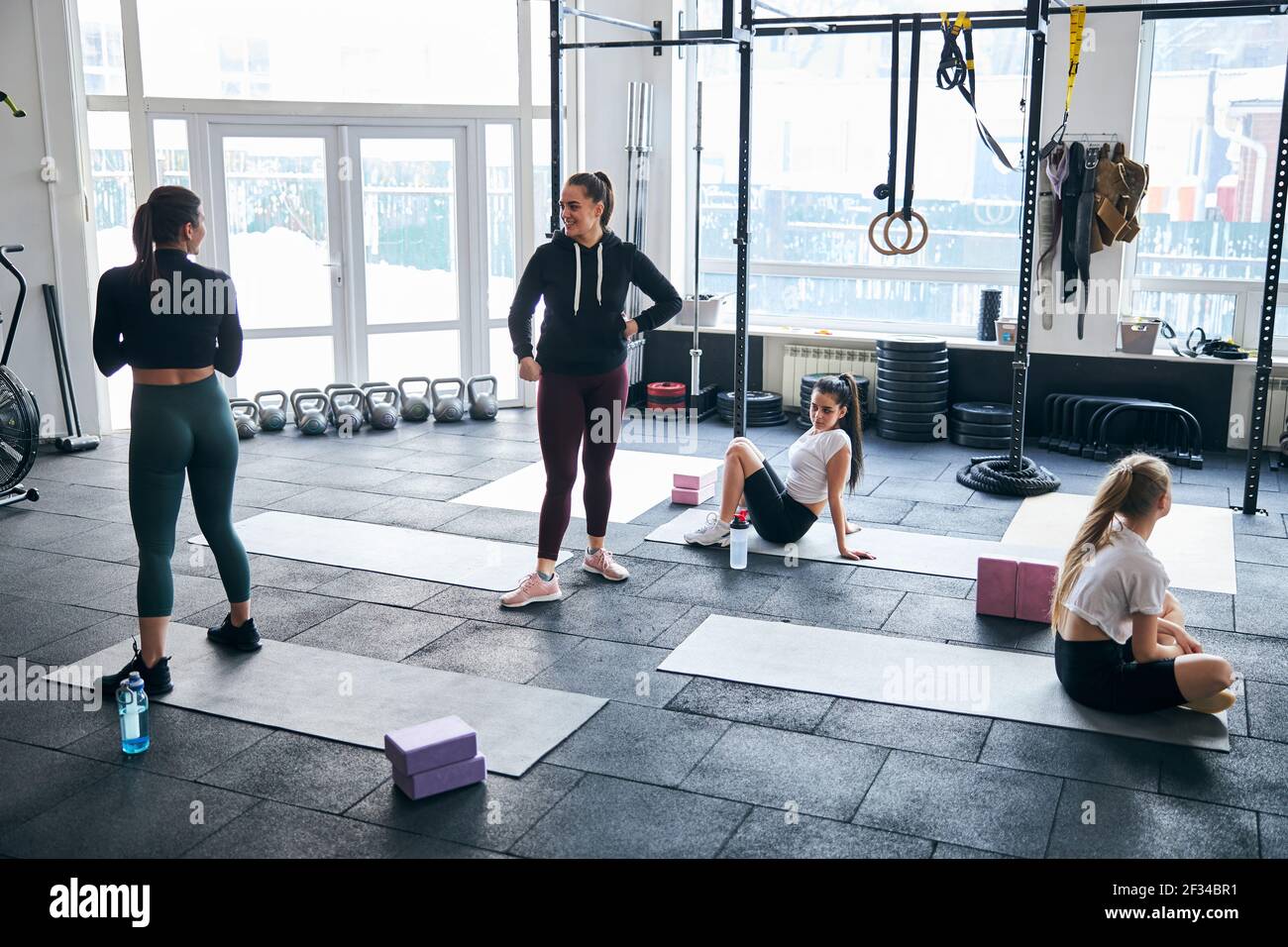 Team spirit is crucial in partner gym exercises Stock Photo - Alamy