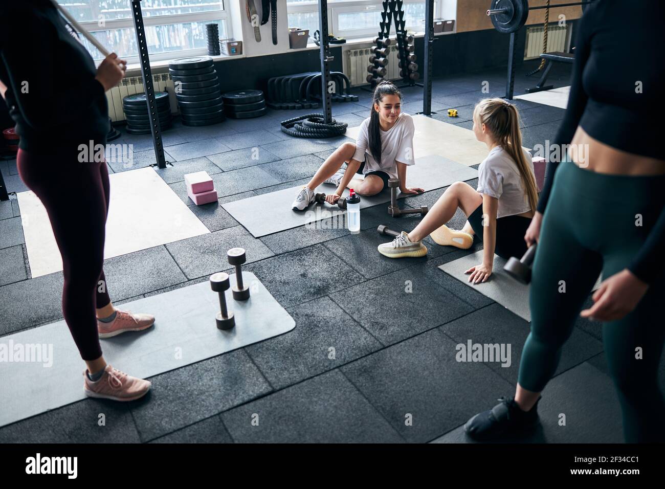 Two best friends keeping up gym routine together Stock Photo - Alamy