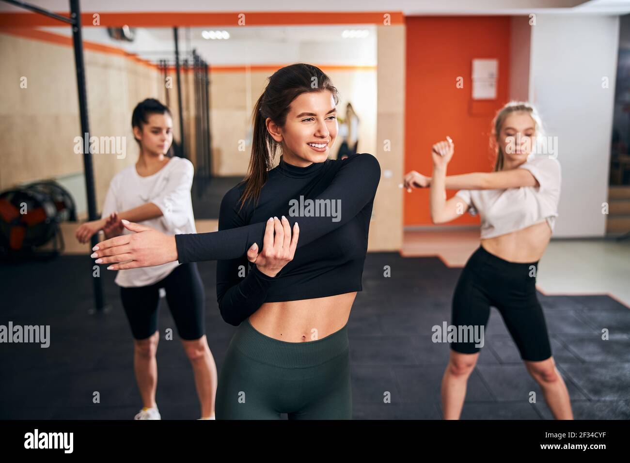 Three best female friends training at gym together Stock Photo - Alamy