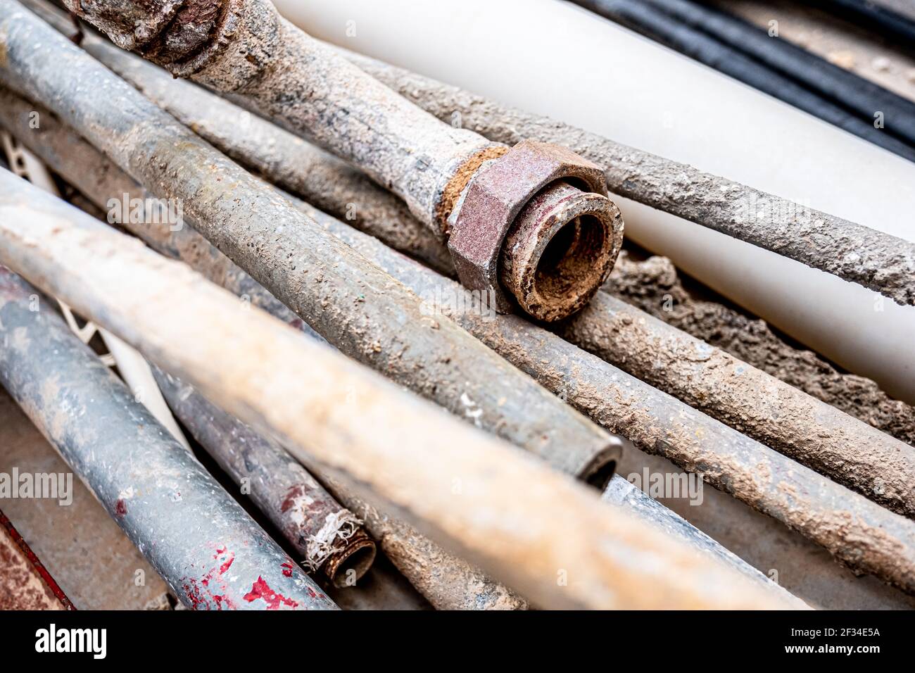 Old rusty pipes thrown away for recycling Stock Photo - Alamy