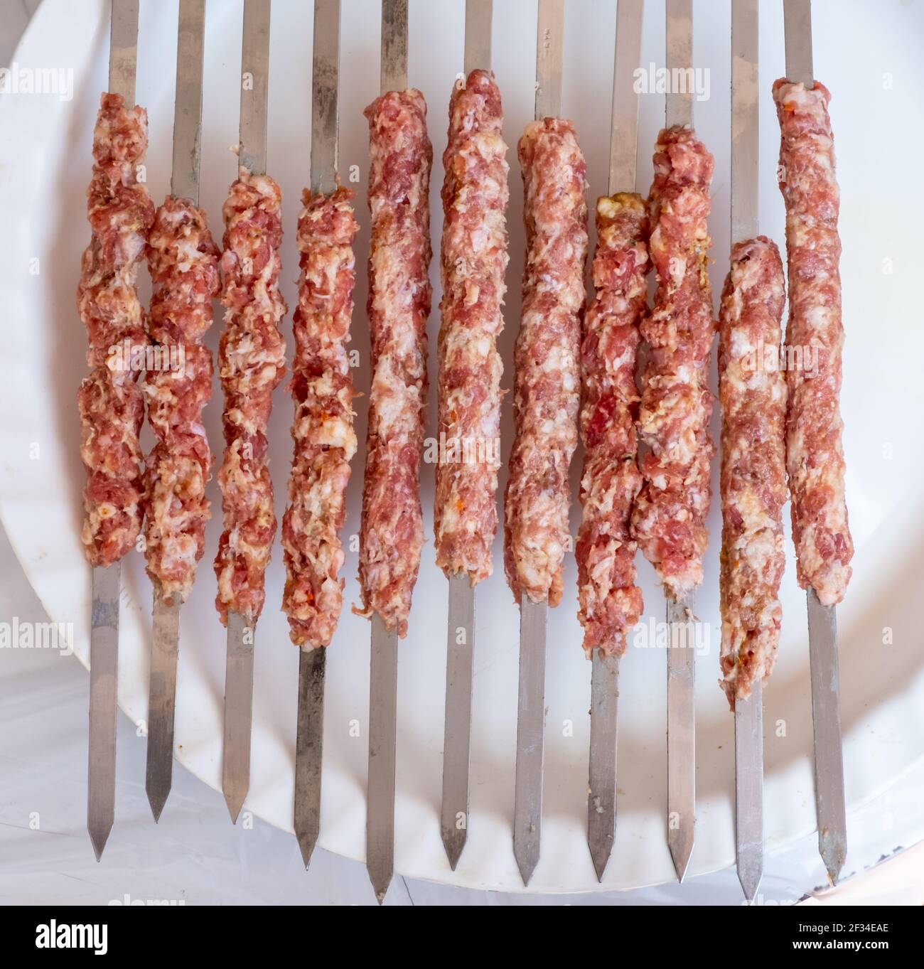 Arabic Muslim family preparing for barbeque Stock Photo - Alamy