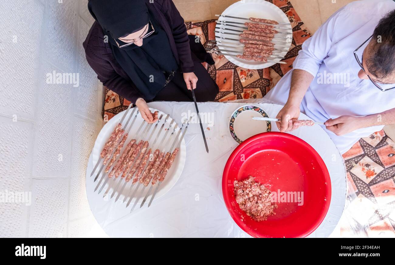 Arabic Muslim family preparing for barbeque Stock Photo - Alamy