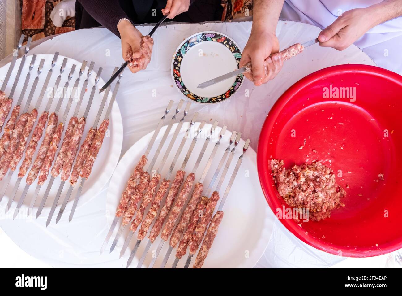 Arabic Muslim family preparing for barbeque Stock Photo - Alamy