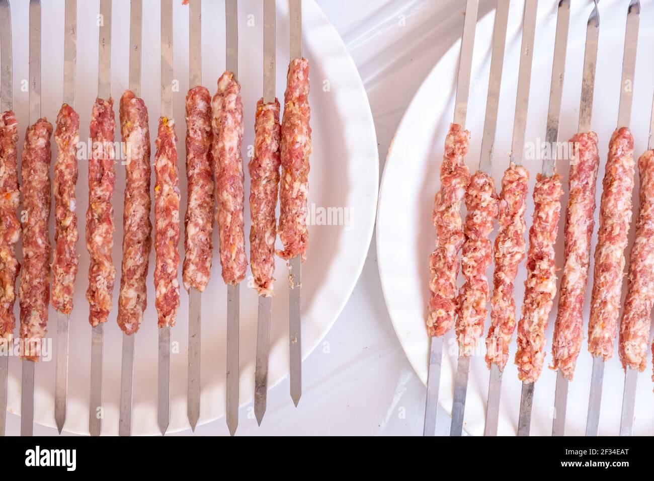 Arabic Muslim family preparing for barbeque Stock Photo - Alamy