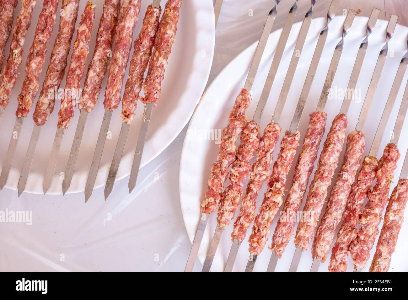 Arabic Muslim family preparing for barbeque Stock Photo - Alamy