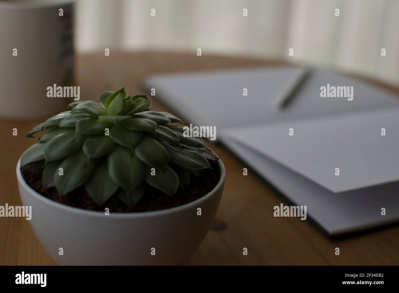 Minimalist work space at home, with cup of coffee and open blank ...