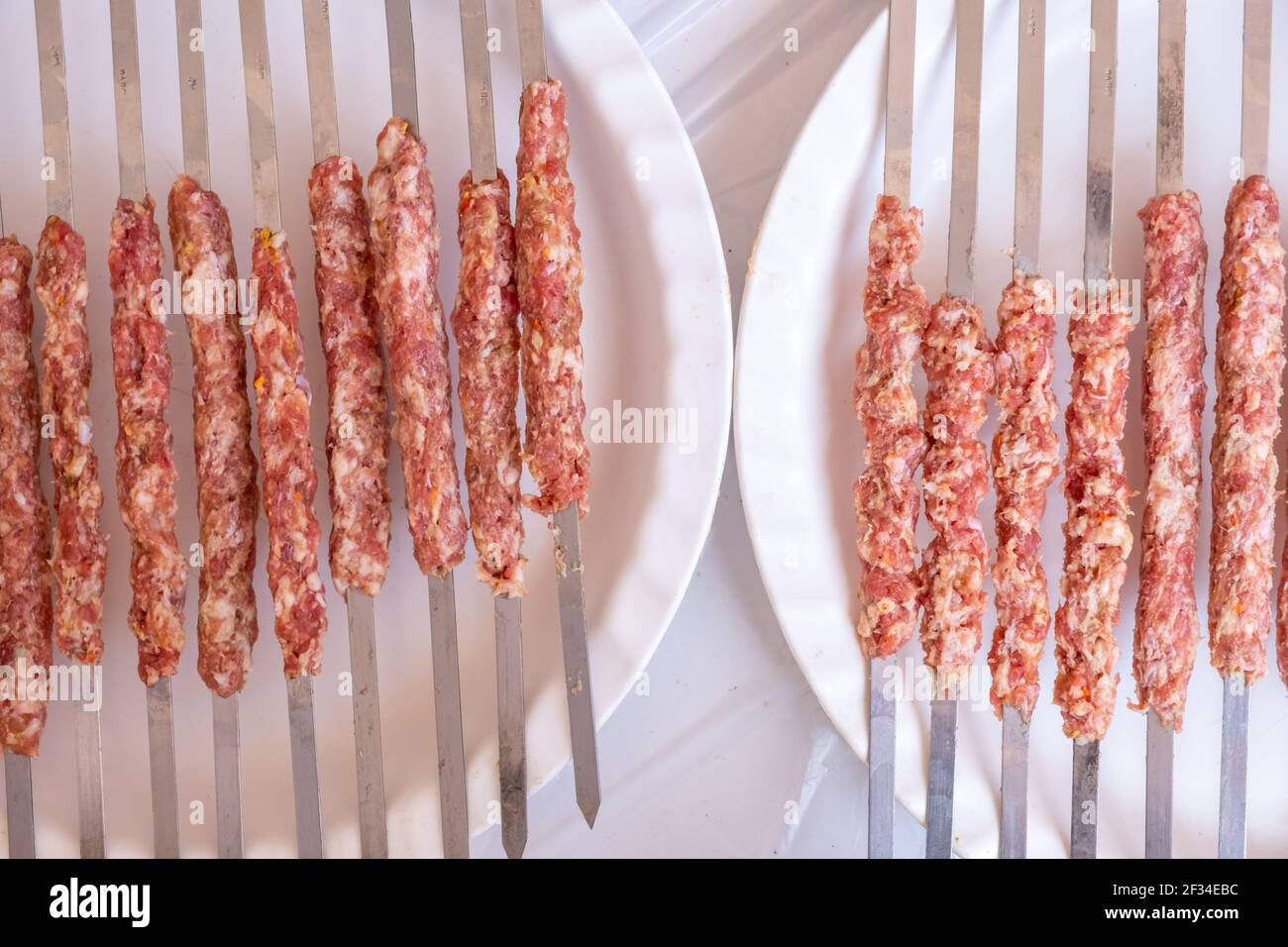 Arabic Muslim family preparing for barbeque Stock Photo - Alamy