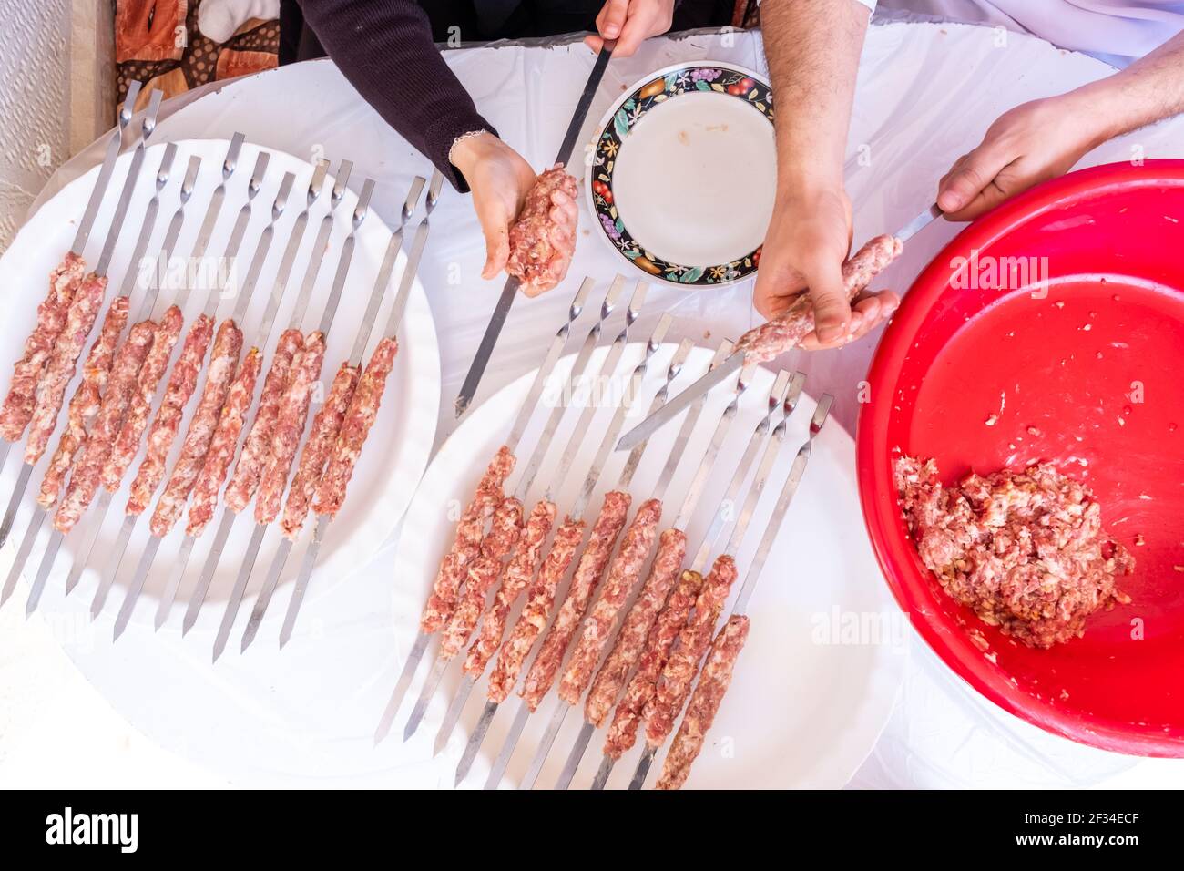 Arabic Muslim family preparing for barbeque Stock Photo - Alamy