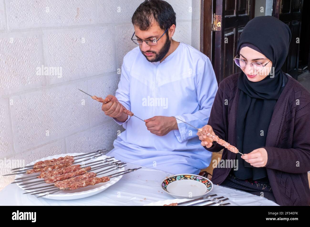 Arabic Muslim family preparing for barbeque Stock Photo - Alamy