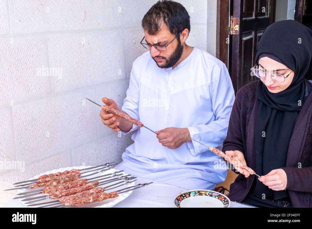 Arabic Muslim family preparing for barbeque Stock Photo - Alamy