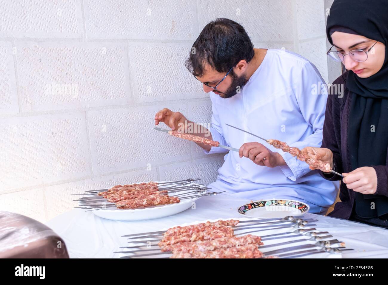 Arabic Muslim family preparing for barbeque Stock Photo - Alamy