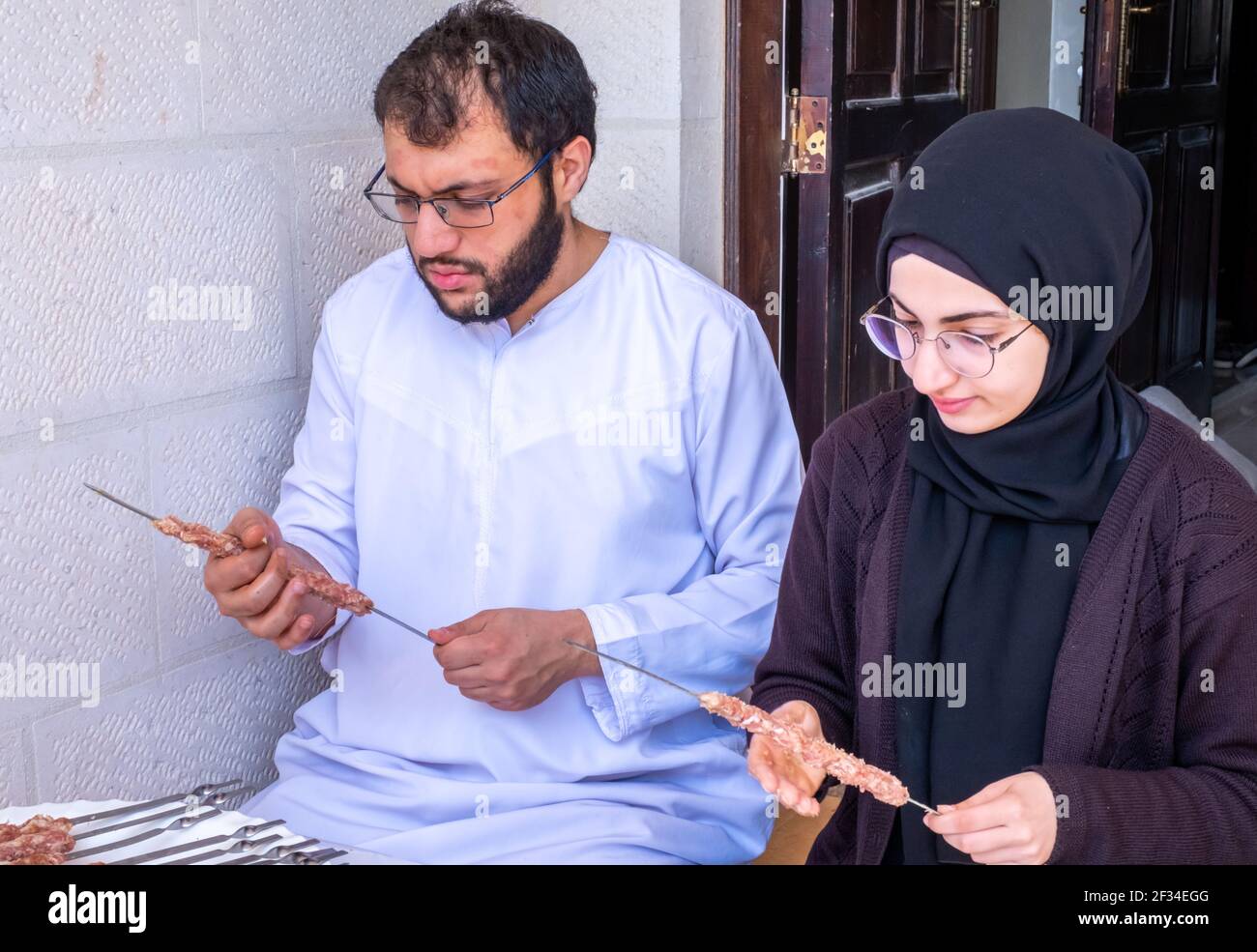 Arabic Muslim family preparing for barbeque Stock Photo - Alamy