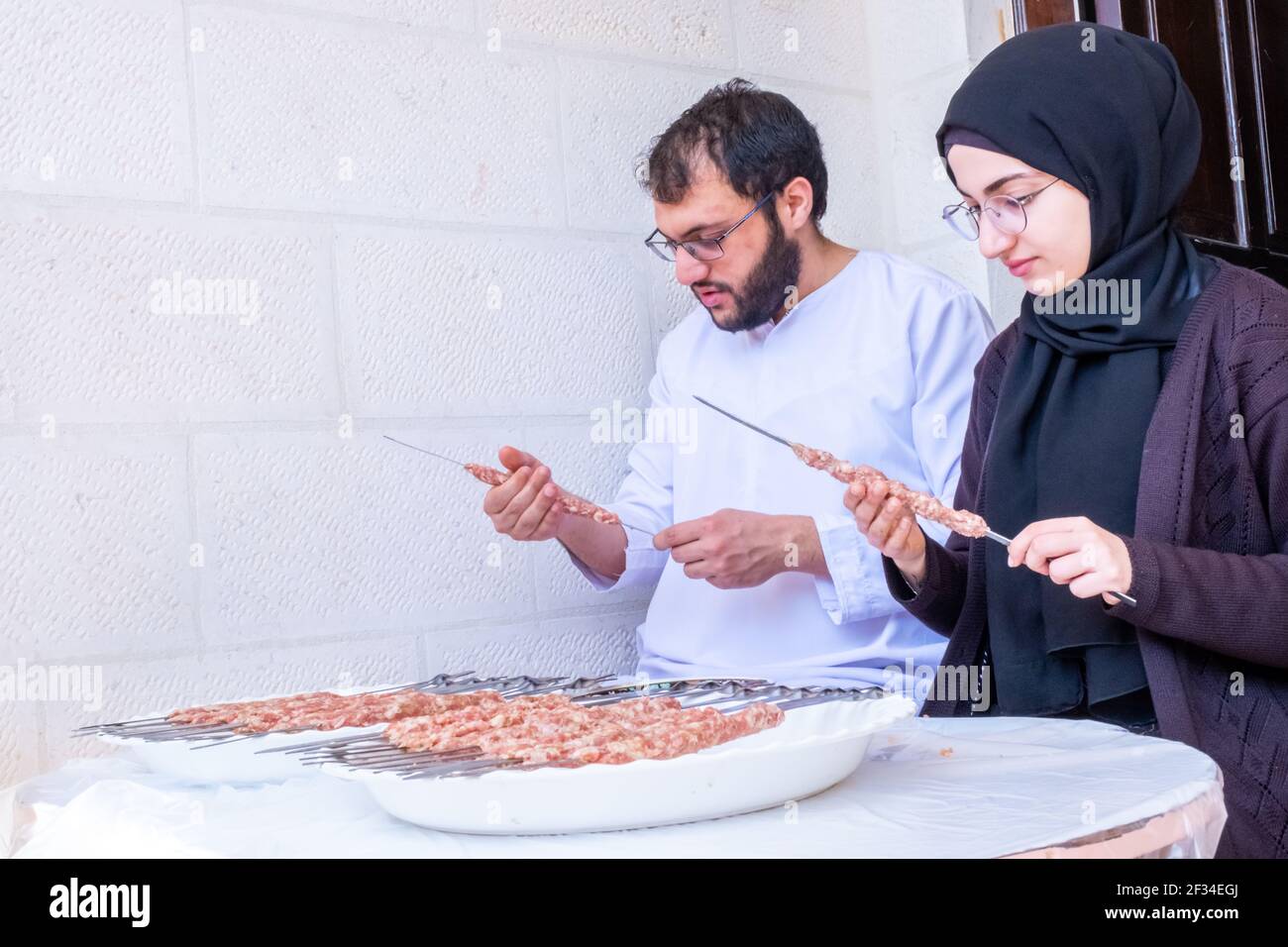 Arabic Muslim family preparing for barbeque Stock Photo - Alamy