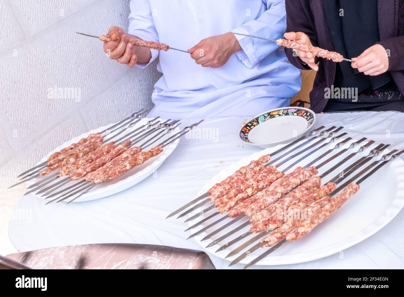 Arabic Muslim family preparing for barbeque Stock Photo - Alamy