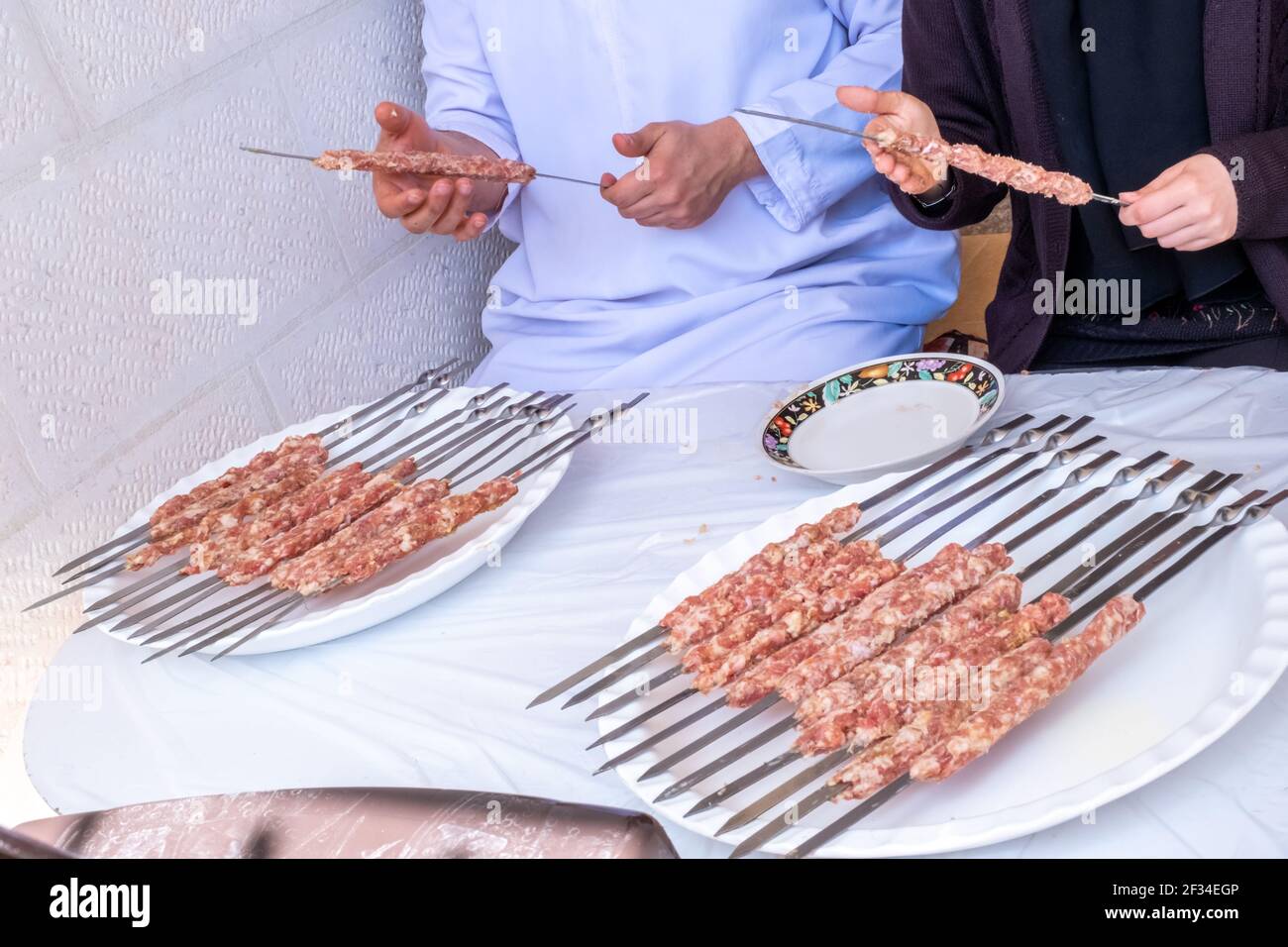 Arabic Muslim family preparing for barbeque Stock Photo - Alamy