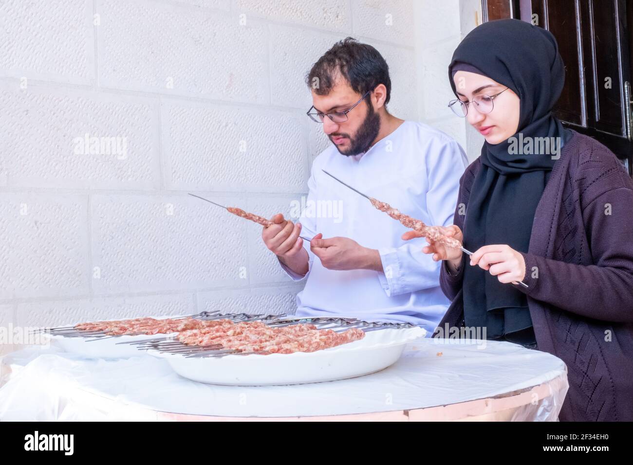 Arabic Muslim family preparing for barbeque Stock Photo - Alamy