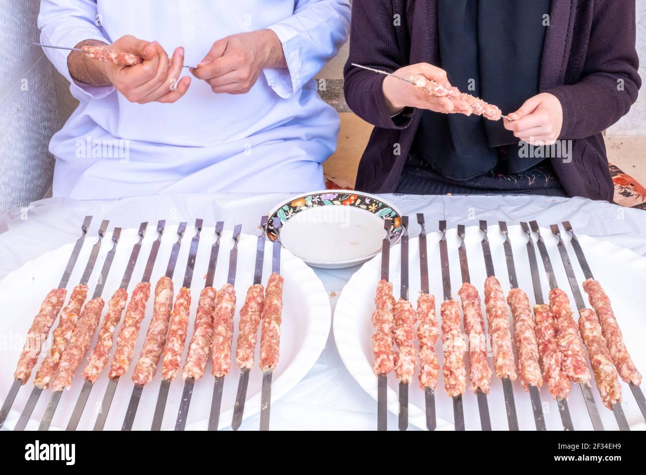 Arabic Muslim family preparing for barbeque Stock Photo - Alamy