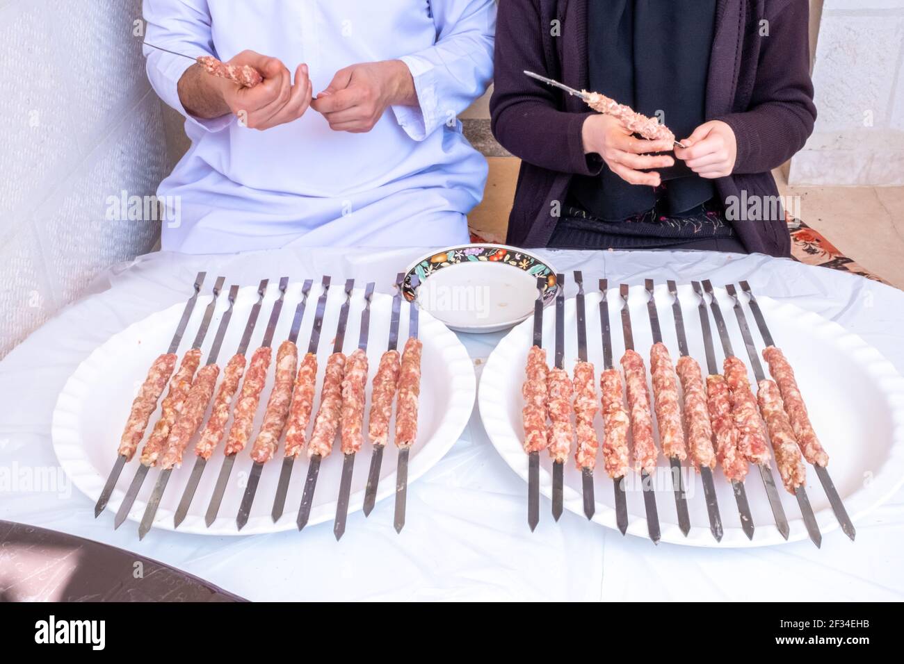 Arabic Muslim family preparing for barbeque Stock Photo - Alamy