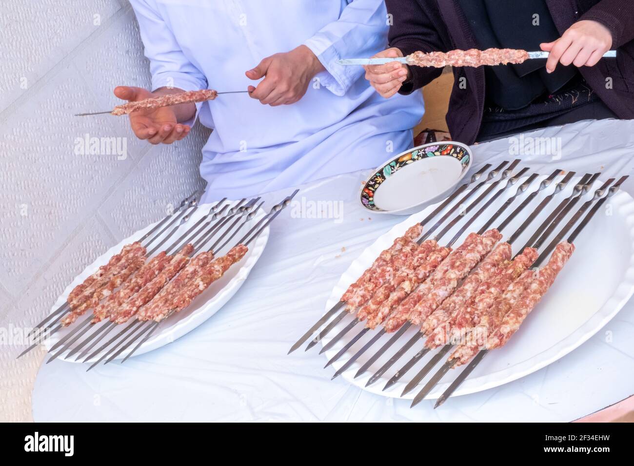 Arabic Muslim family preparing for barbeque Stock Photo - Alamy