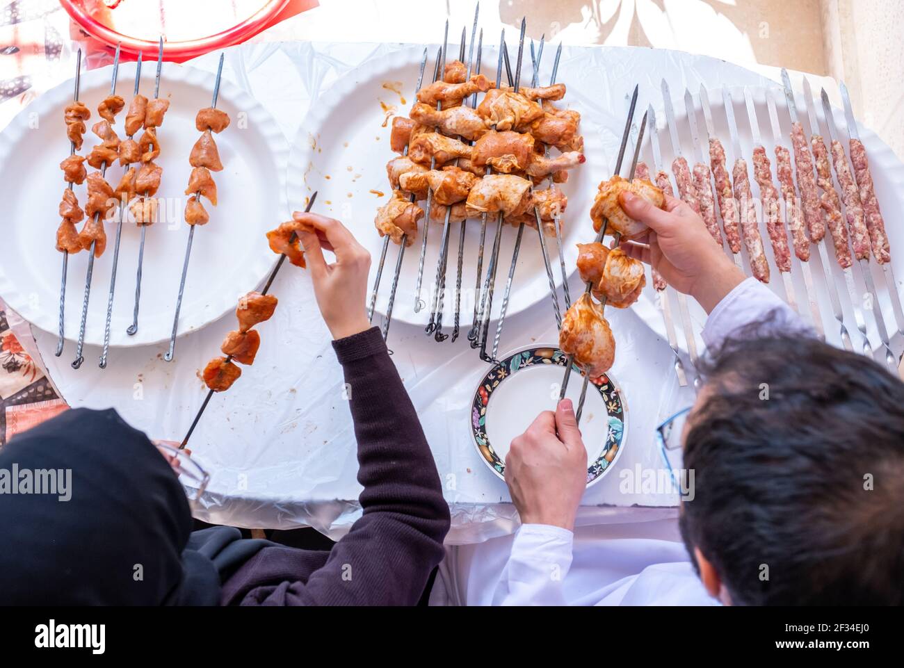 Arabic Muslim family preparing for barbeque Stock Photo - Alamy