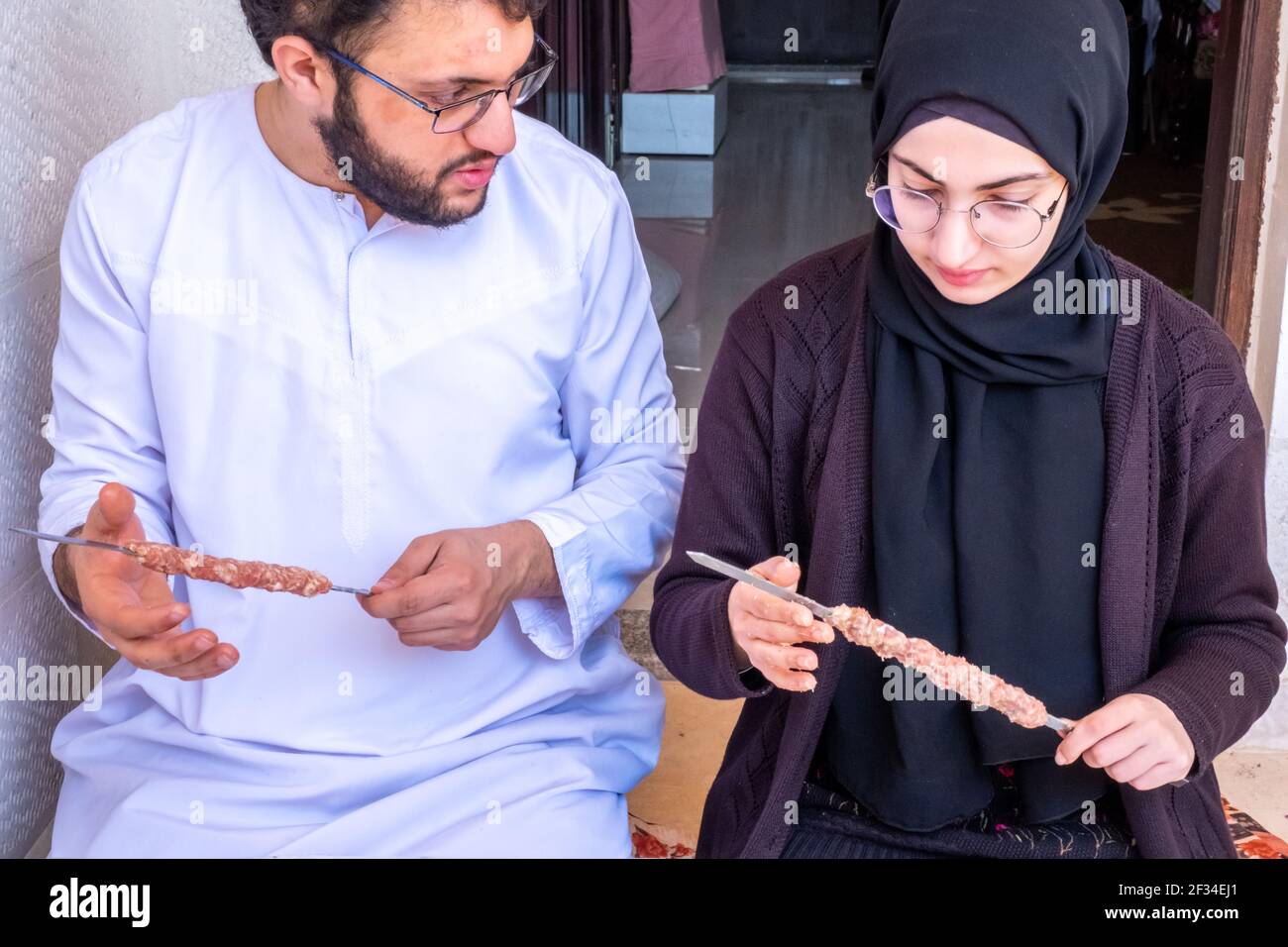 Arabic Muslim family preparing for barbeque Stock Photo - Alamy