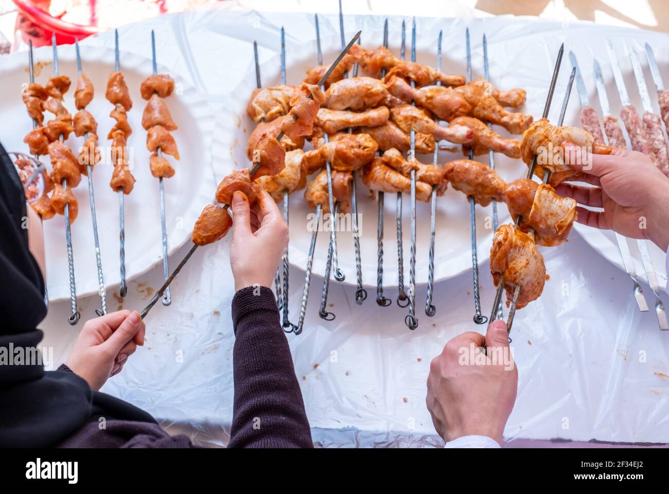 Arabic Muslim family preparing for barbeque Stock Photo - Alamy