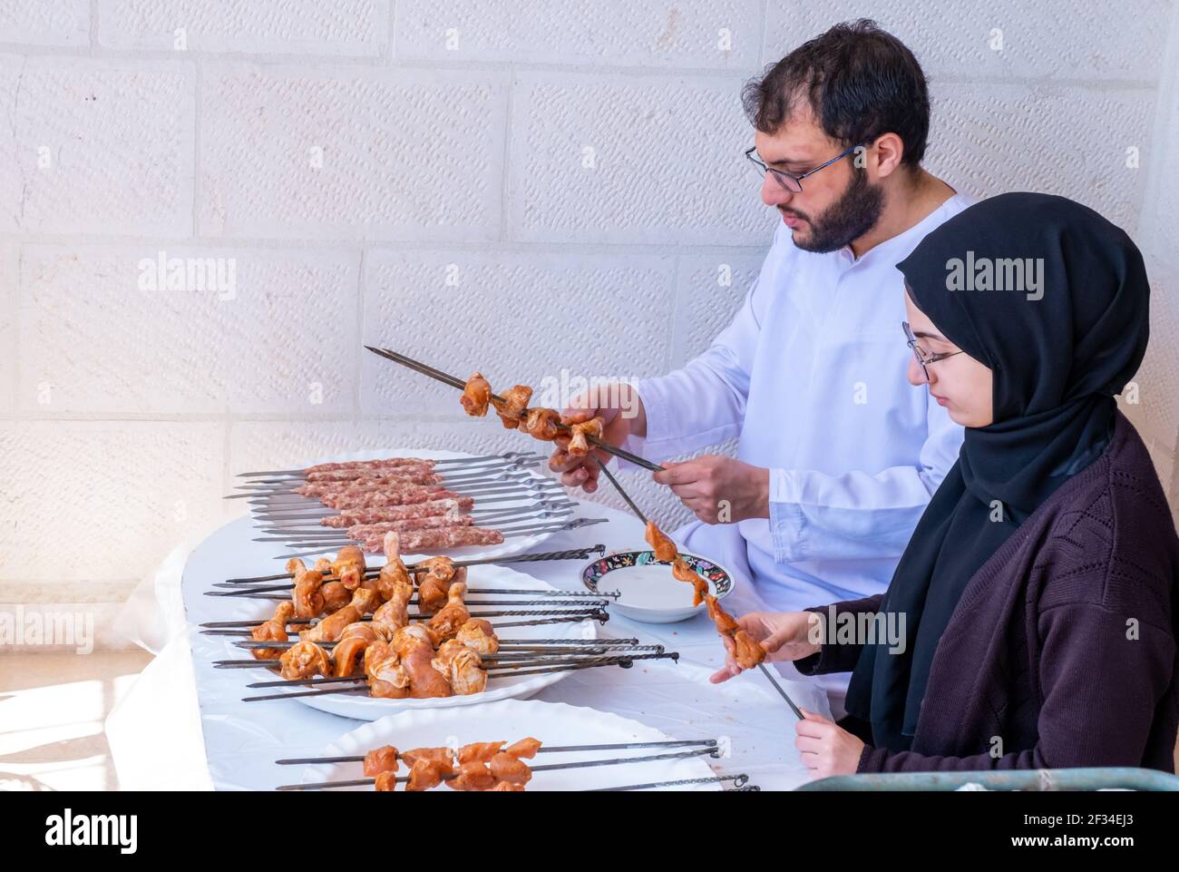 Arabic Muslim family preparing for barbeque Stock Photo - Alamy