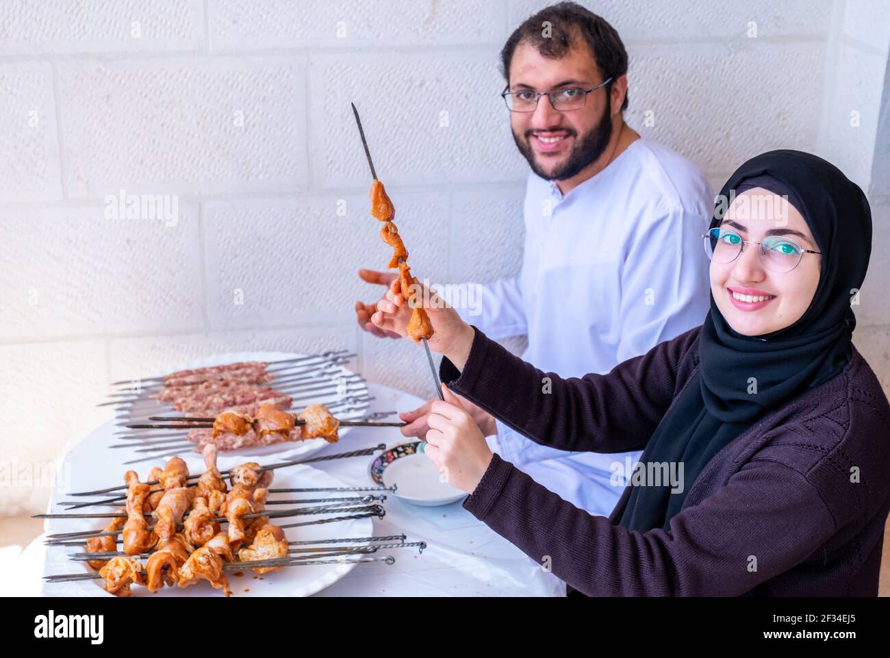 Arabic Muslim family preparing for barbeque Stock Photo - Alamy