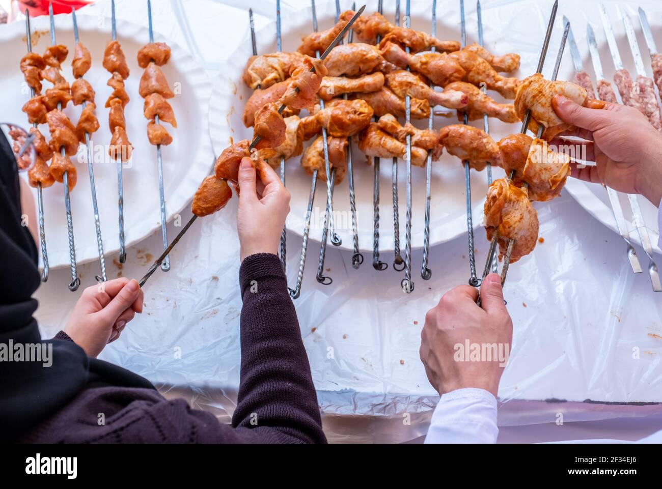 Arabic Muslim family preparing for barbeque Stock Photo - Alamy